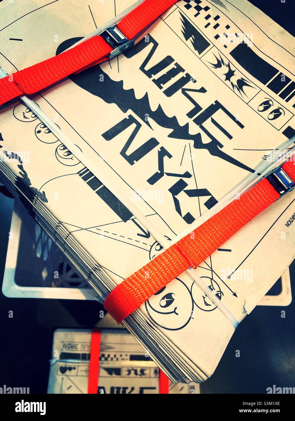 Bundles of Nike NYC flyers at the entrance of the Nike flagship store ...