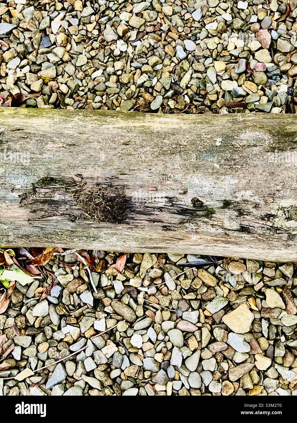 Rustic wooden sleeper on a gravel path - storm damage in Pembrokeshire ...
