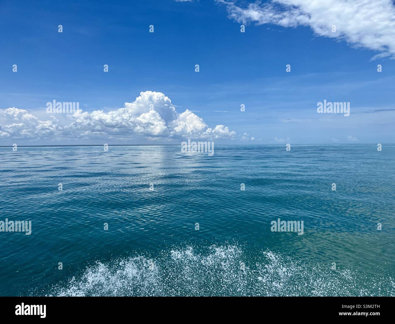 Ocean, water spray and clouds Stock Photo - Alamy