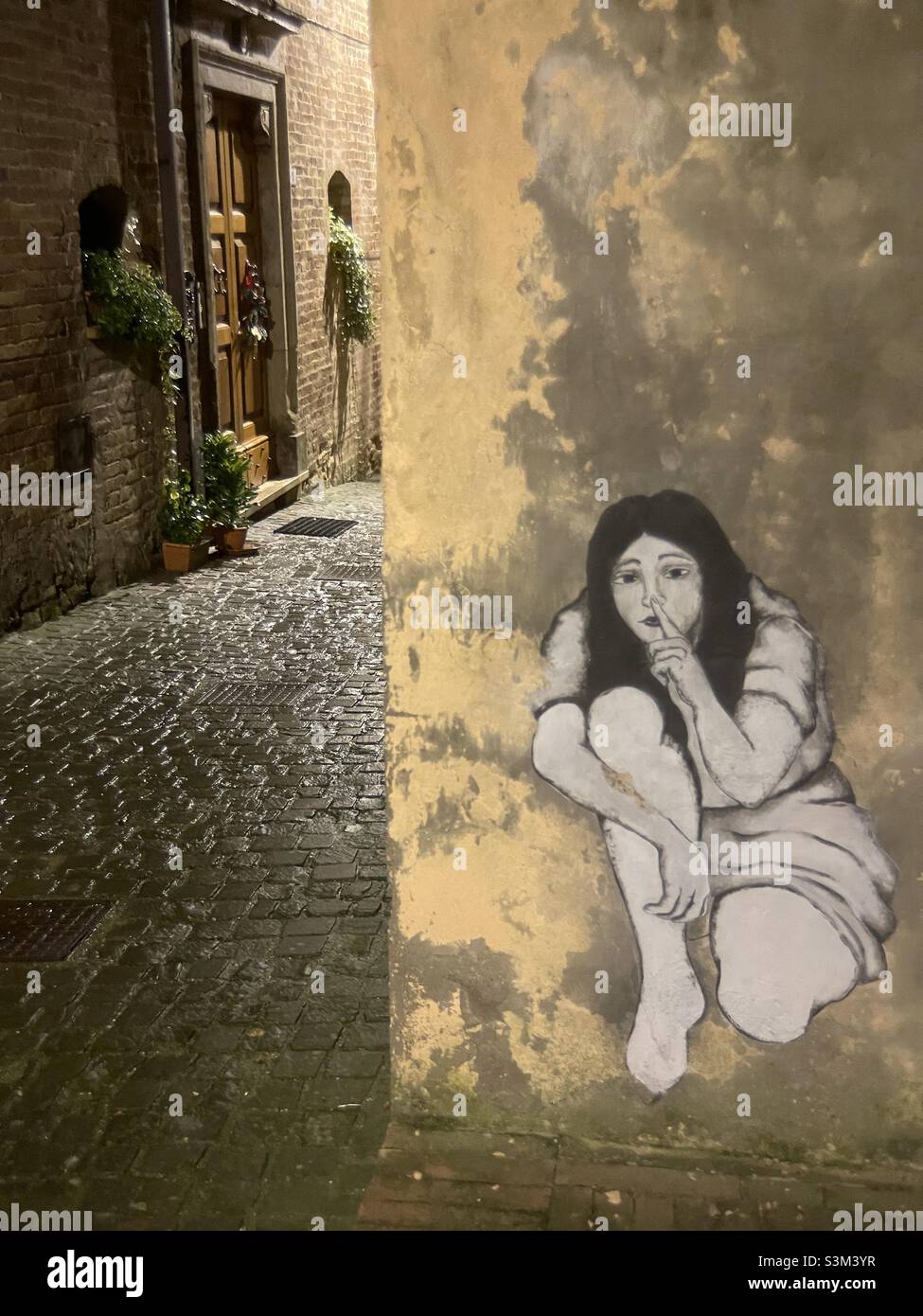 Silence please, conceptual murales on a wall next to a silent alley in ...