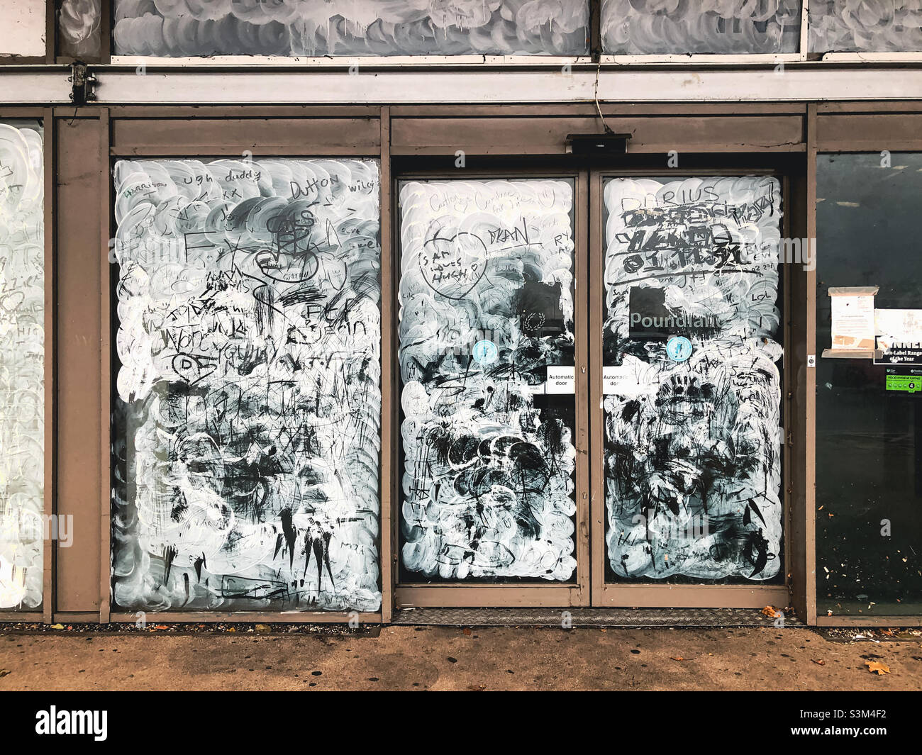 A shop which has closed down and it’s windows have been whited out ...