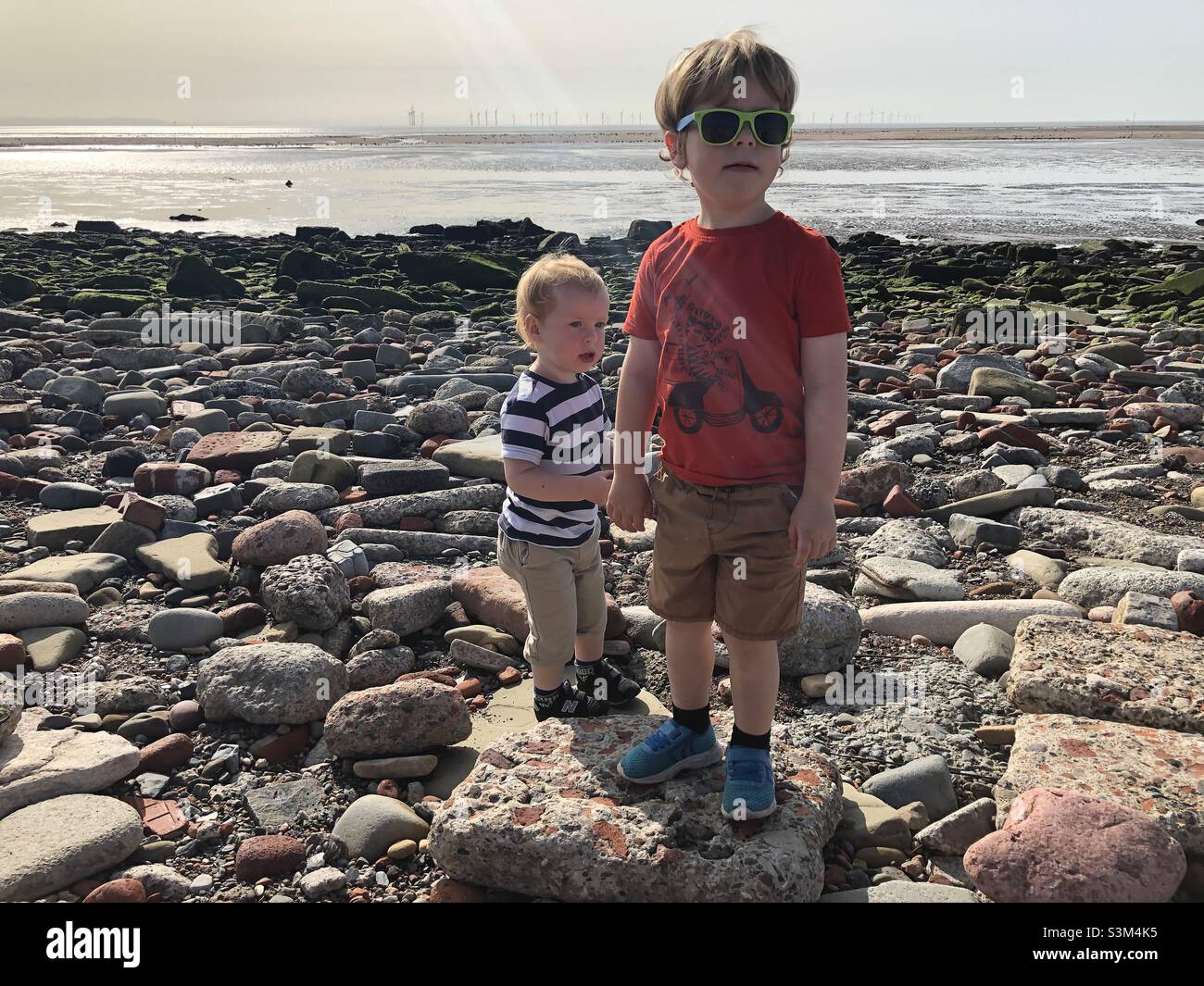 Young boy and his brother looking cool in sunglasses Stock Photo - Alamy