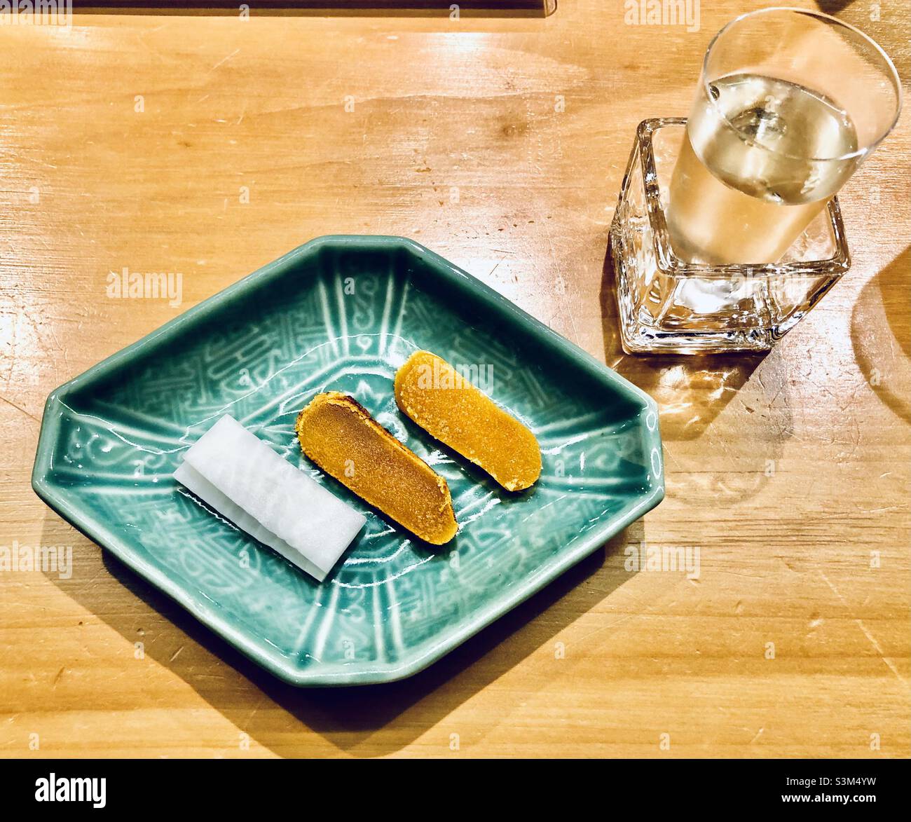 Karasumi, Japanese salted mulled roe, on a green celadon plate, and a ...