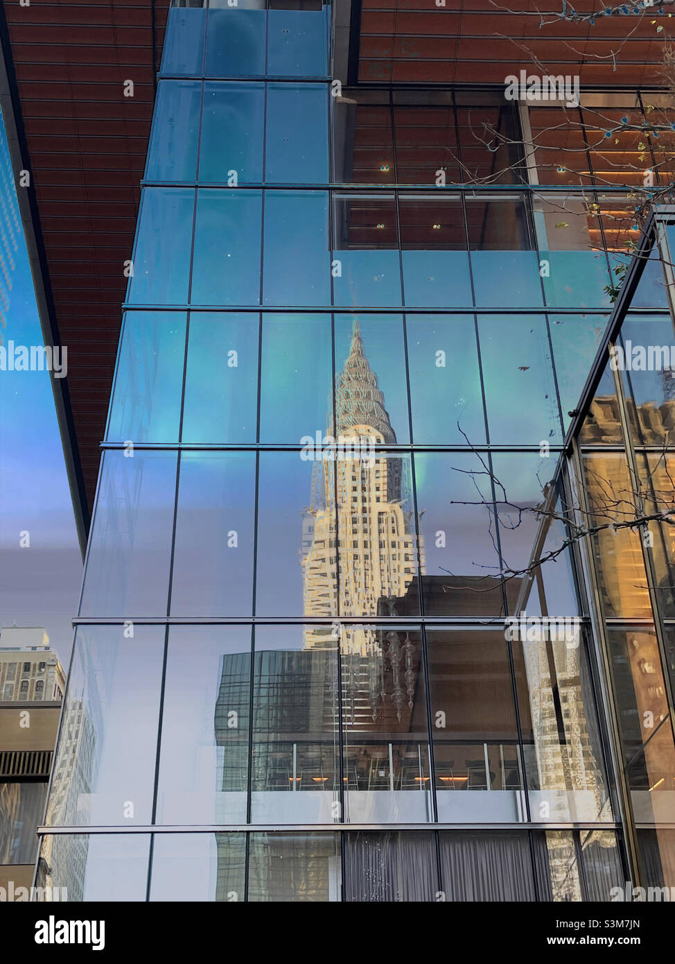 Reflections of the iconic Chrysler building in the glass front of One ...