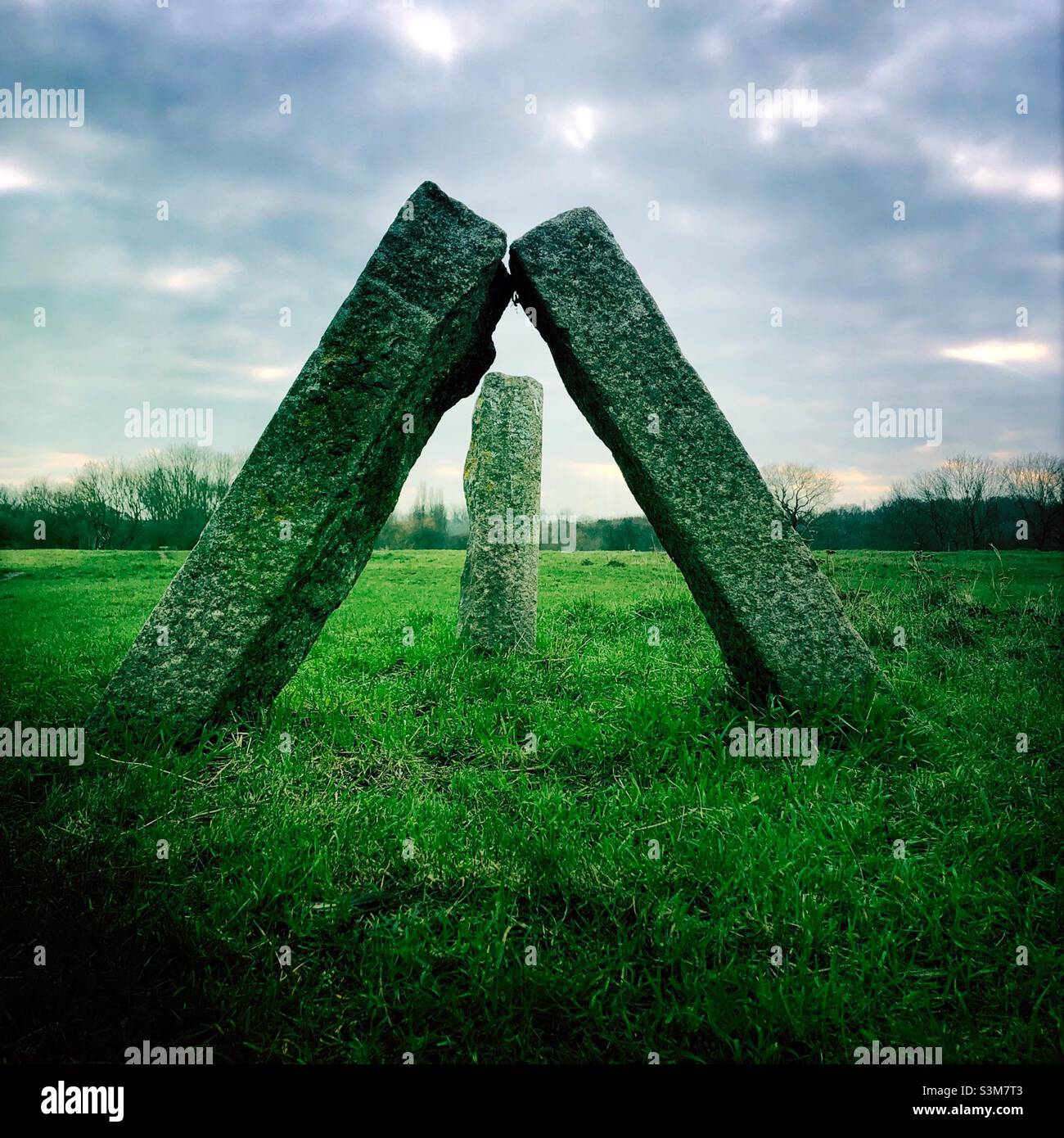 Erected stones creating a triangle like shape Stock Photo - Alamy