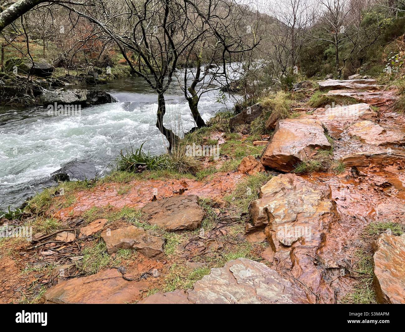 Reddish rocks beside the Aberglaslyn Pass, a narrow gorge of ...