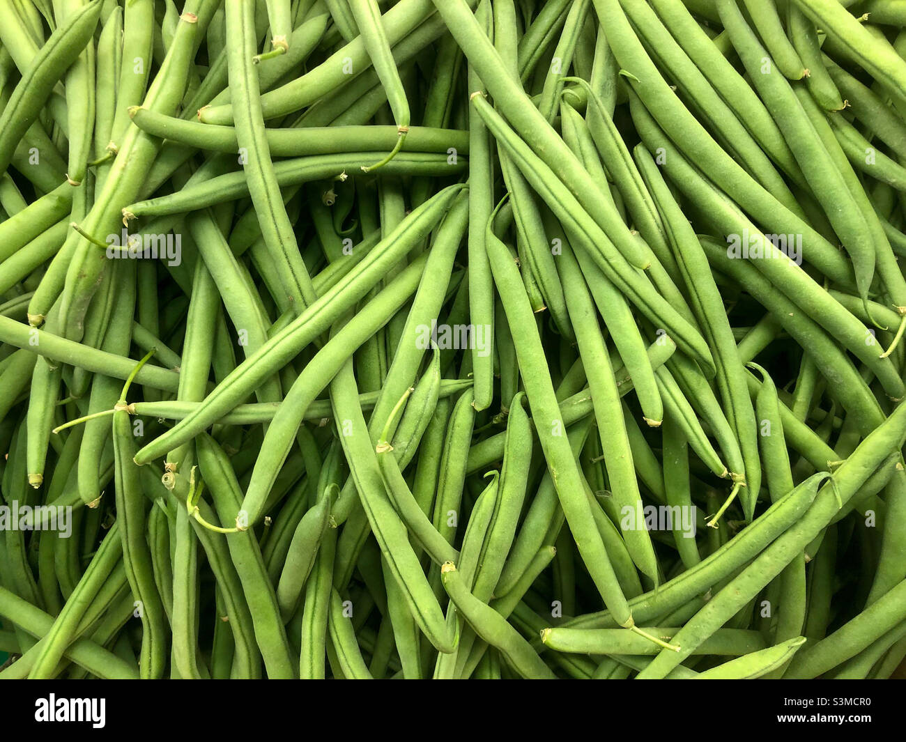 Thin beans on sale in a store Stock Photo - Alamy