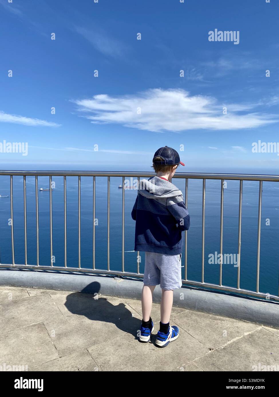 Little boy looking at the view from an observation point in Gibraltar ...