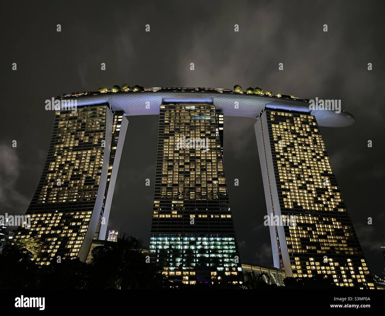 Singapore Marina Bay Sands glows at night Stock Photo - Alamy