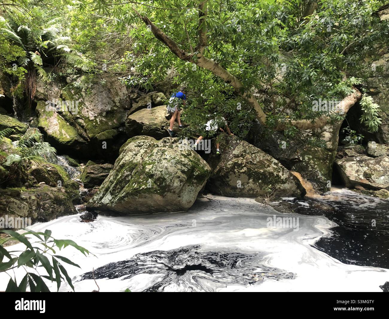 Children climbing rocks hi-res stock photography and images - Alamy