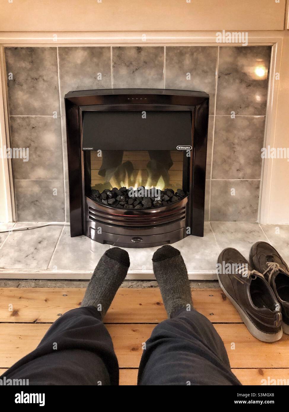 Cosy fire feet hi-res stock photography and images - Alamy