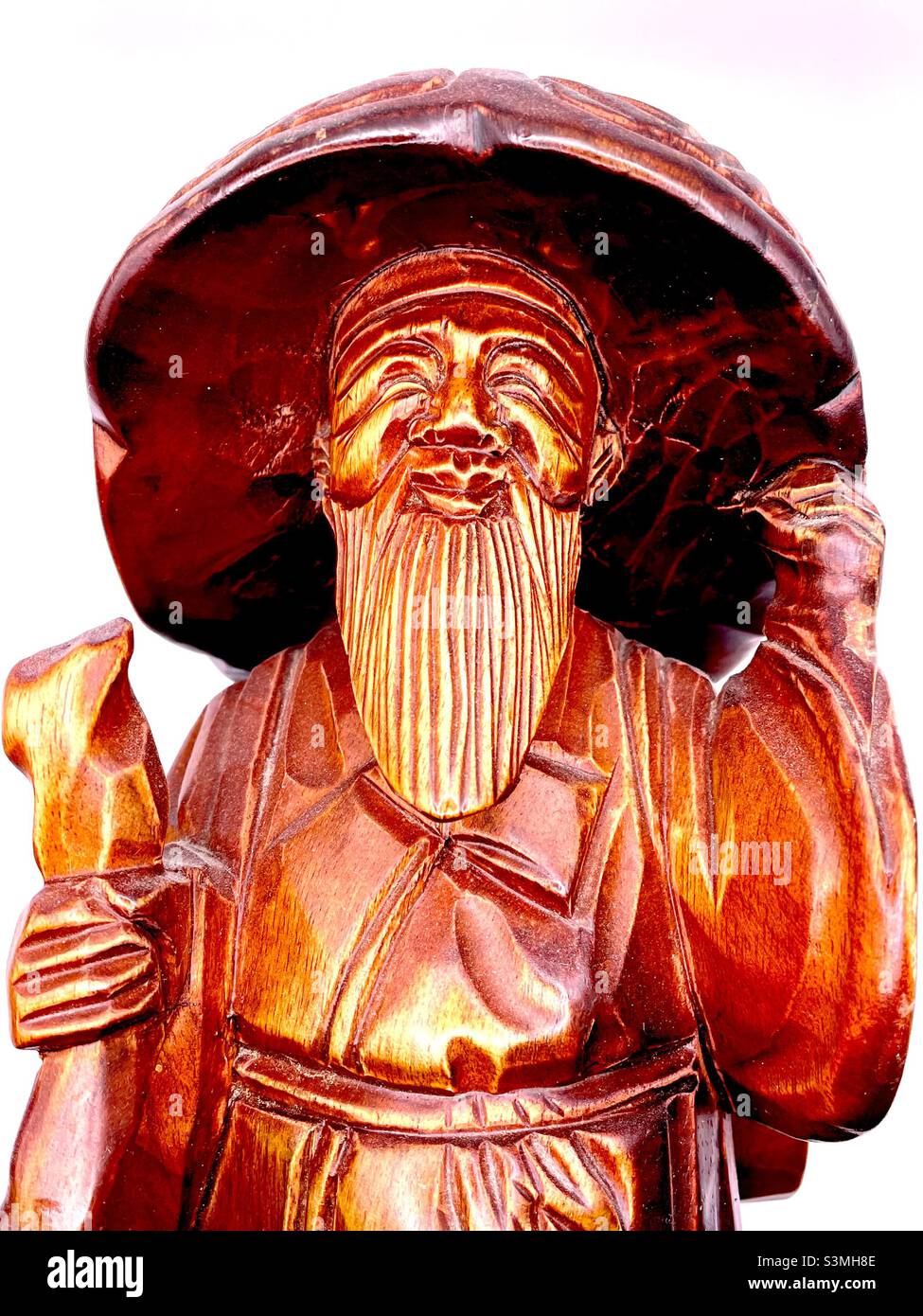 Korean traveling monk statue made of wood with white background Stock ...