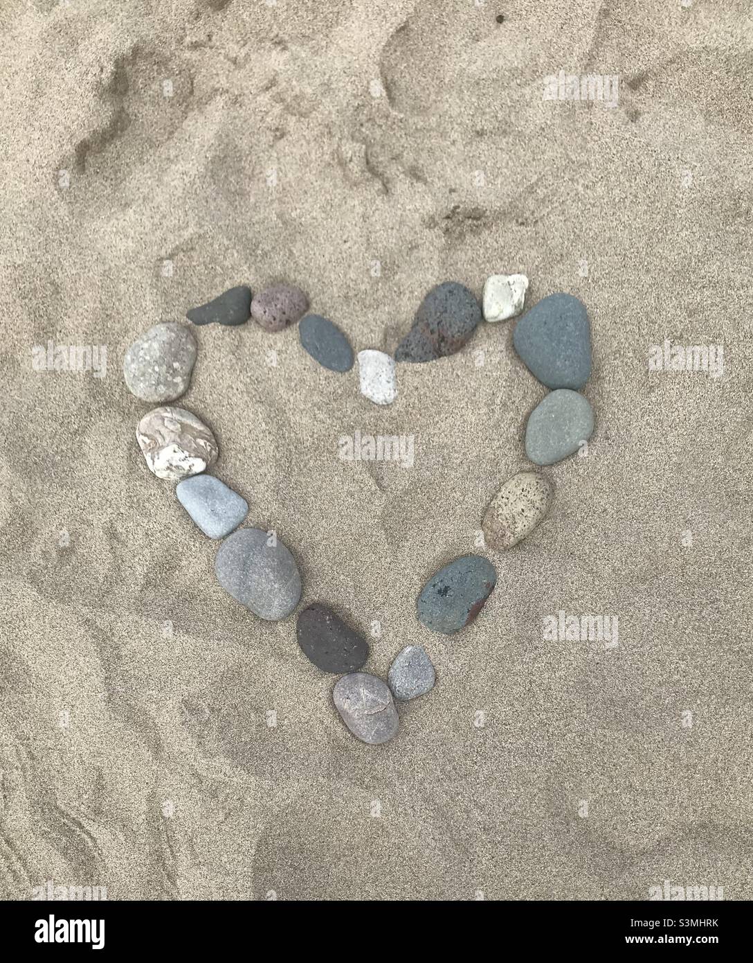 Pebbles heart hi-res stock photography and images - Alamy