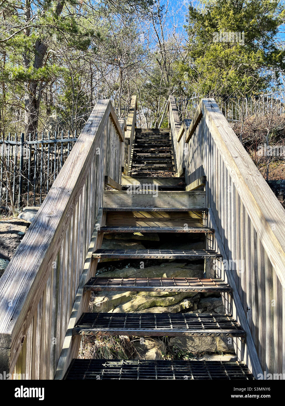 Wooden outdoor staircase that leads up the side of a mountain to a ...