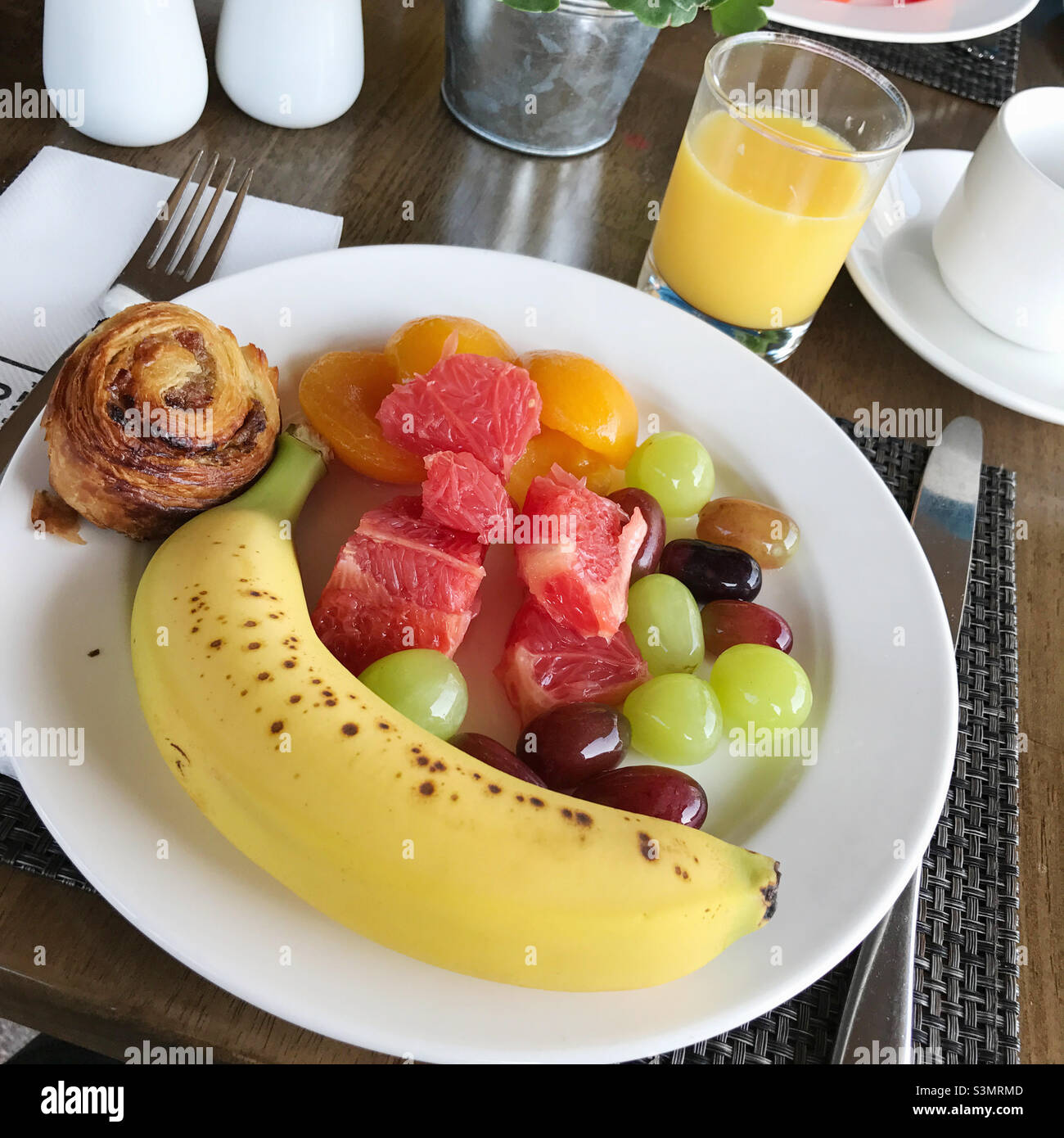 A healthy lifestyle choice for breakfast includes assorted fruits and a ...