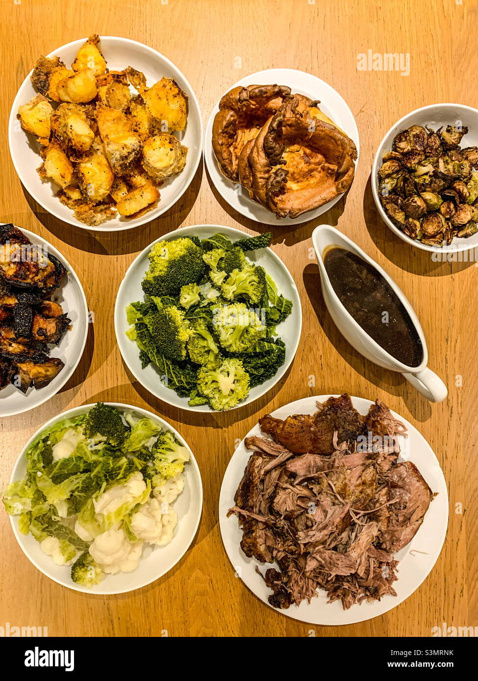 Roast beef dinner on plates Stock Photo - Alamy