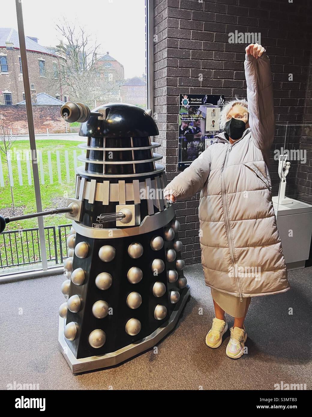 Woman pretending (badly) to be a dalek Stock Photo - Alamy