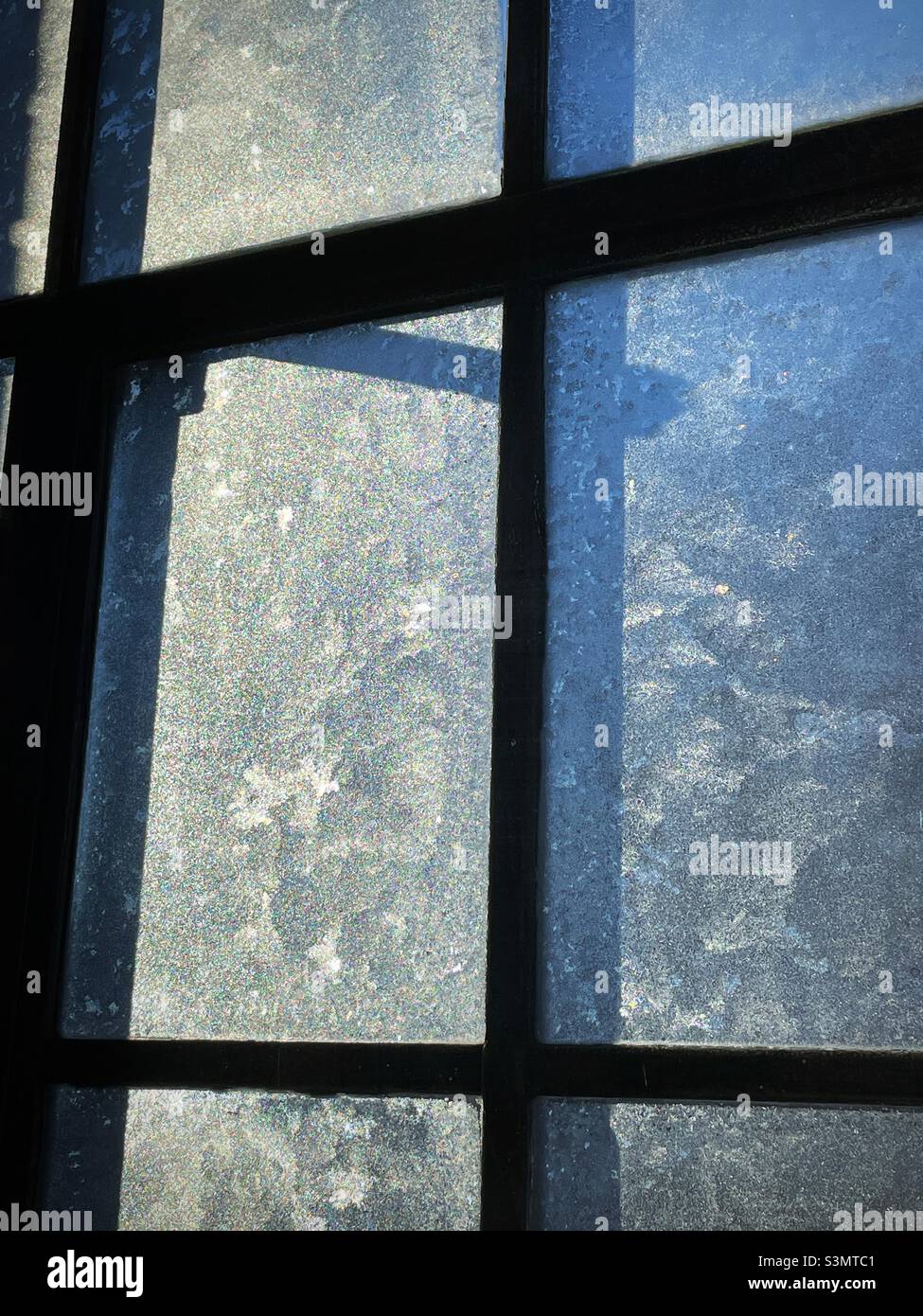 New York City apartment casement window covered with ice during a cruel ...