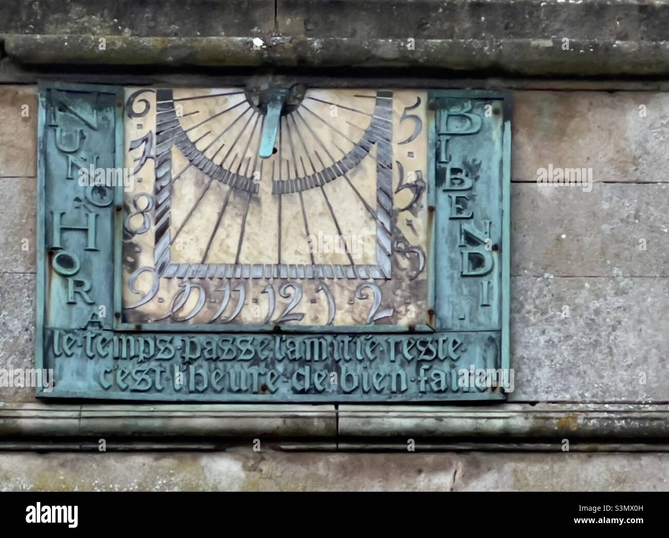A bronze wall mounted sundial in the garden of a Rutland country house ...