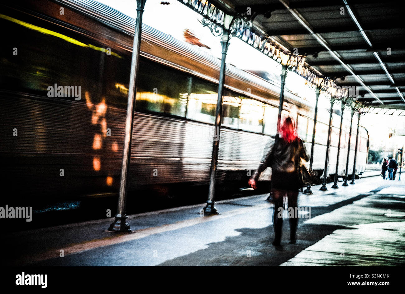 Running for the train - grainy and blurred image of a woman running ...