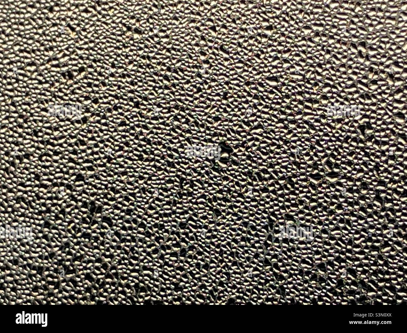 An almost uniform field of small water droplets on a window pane ...