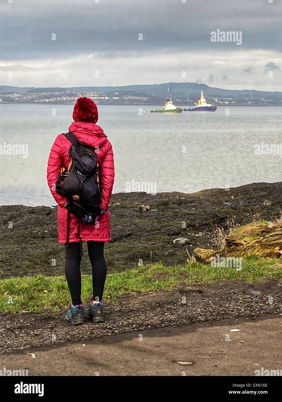 Woman watching boats hi-res stock photography and images - Alamy