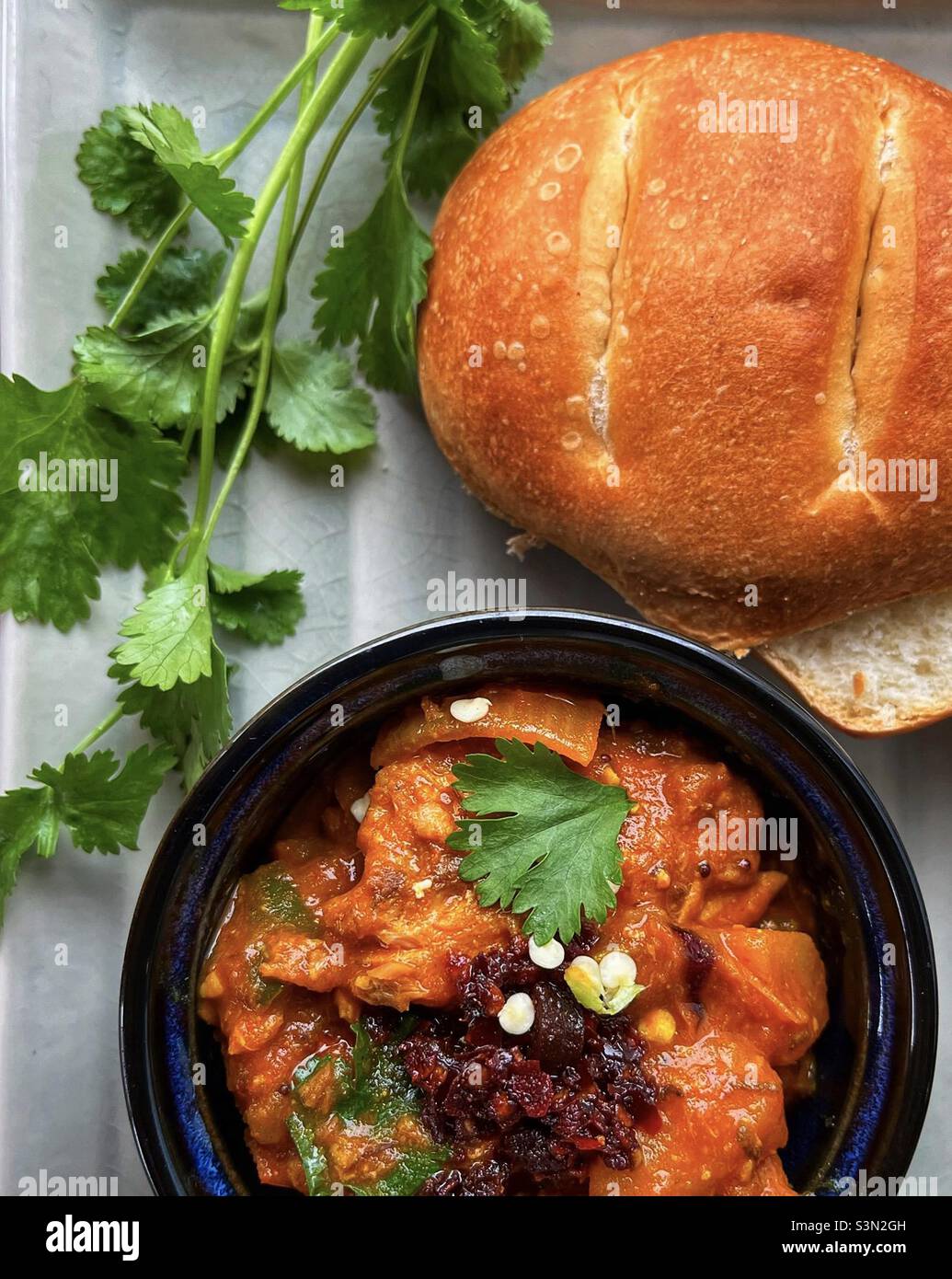 Roti and curry Stock Photo - Alamy