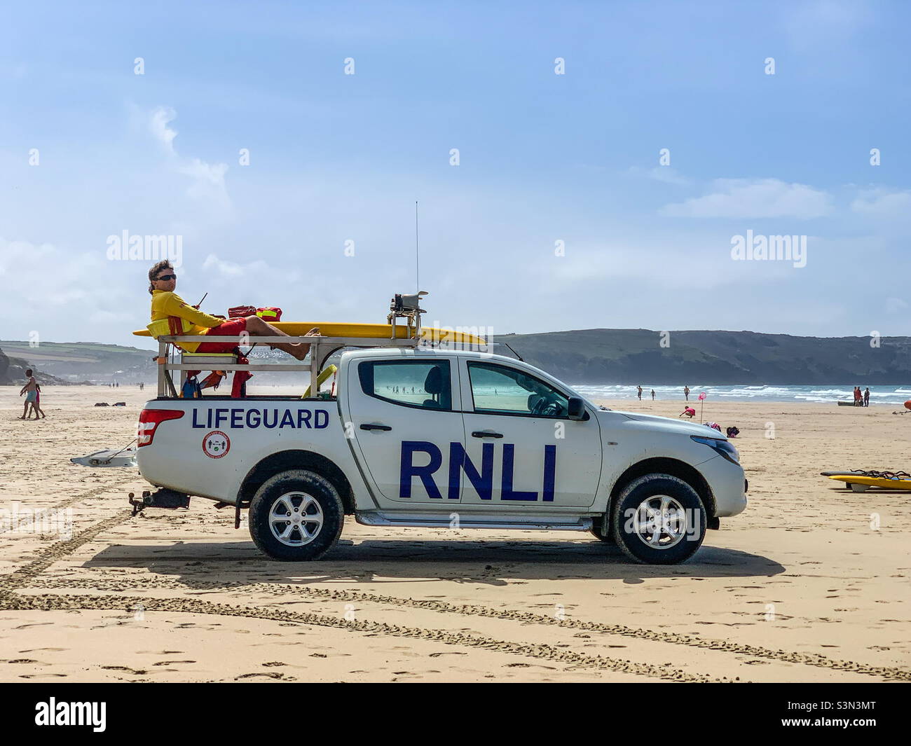 RNLI lifeguard on Perranporth beach in Cornwall Stock Photo - Alamy