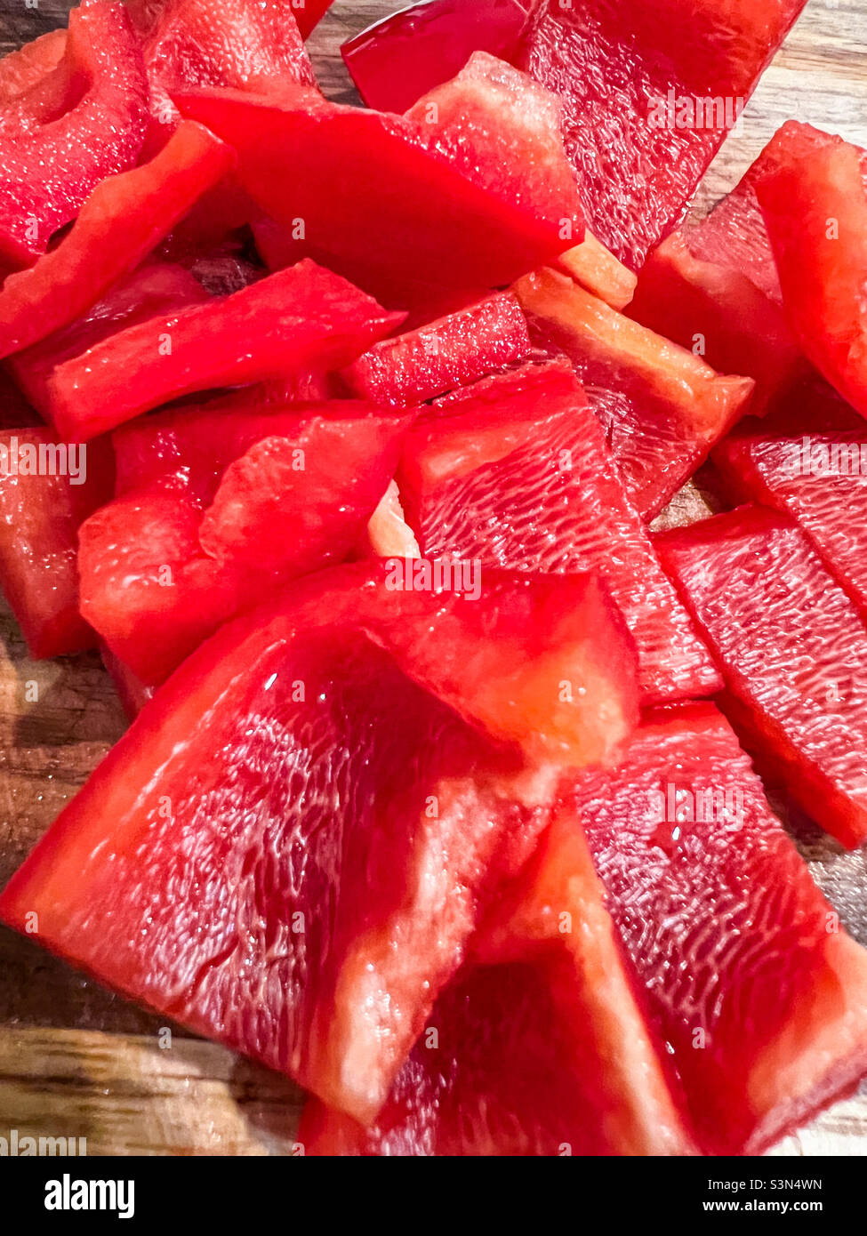 Chunks of chopped red peppers Stock Photo - Alamy