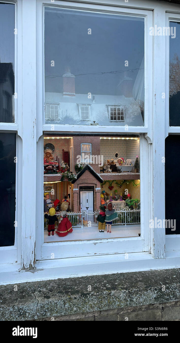 Christmas figures dolls house window scene UK Stock Photo - Alamy