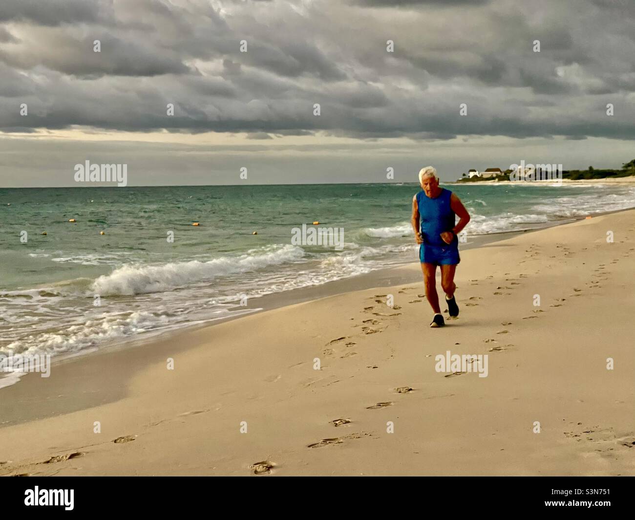 Runner on the beach High Resolution Stock Photography and Images - Alamy