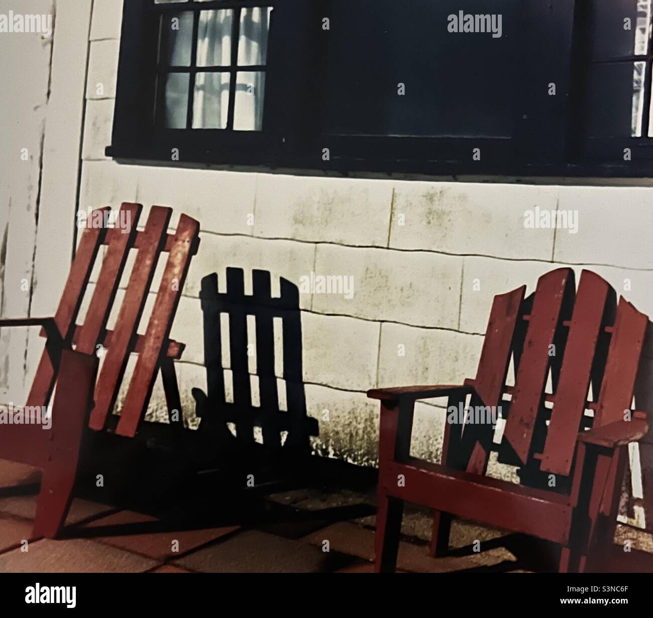 Provincetown Beach Cottage with red chairs Stock Photo - Alamy