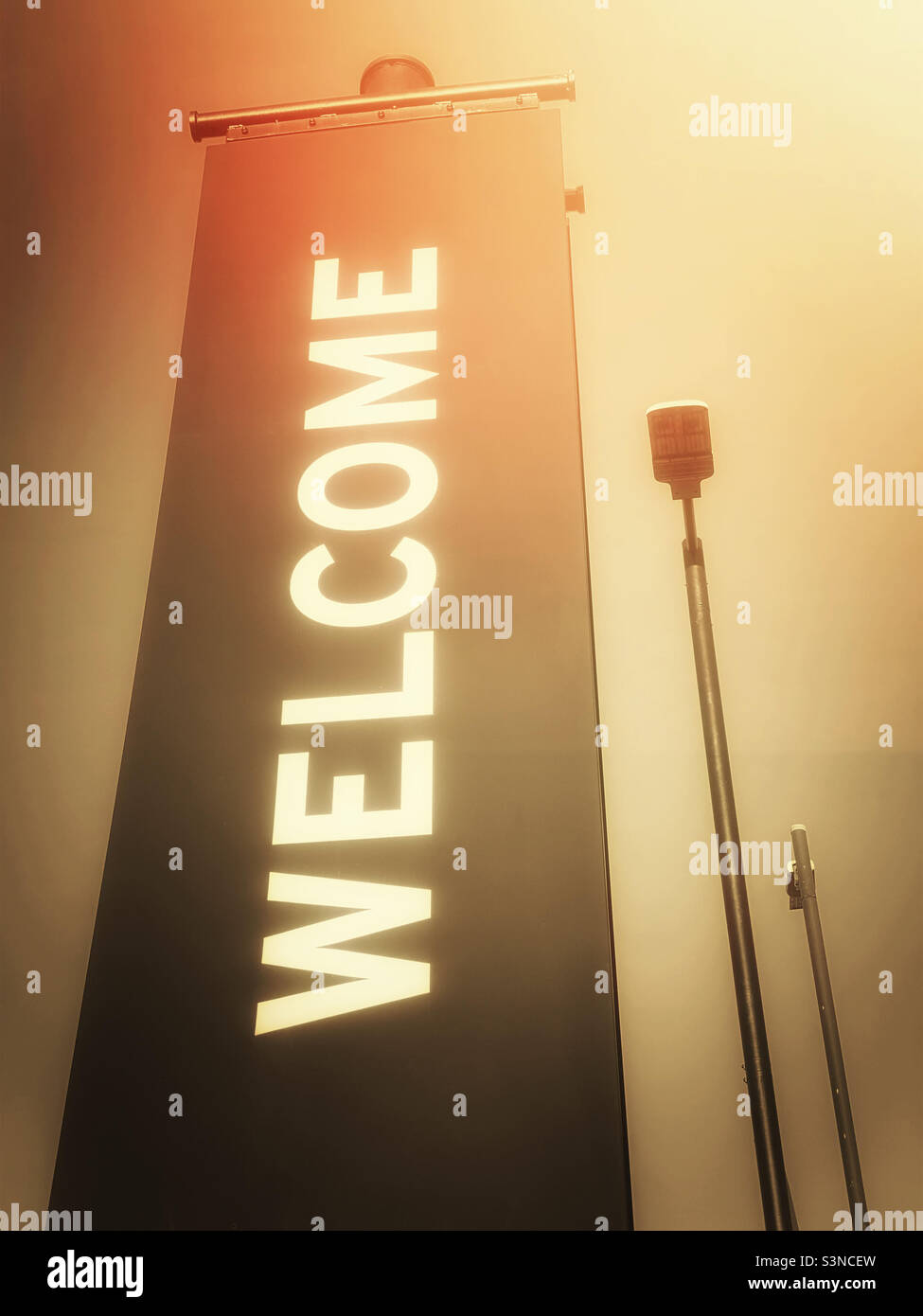 WELCOME sign. Sunset? Sunrise? Lens flare? Film fogging? Photo ©️ COLIN ...