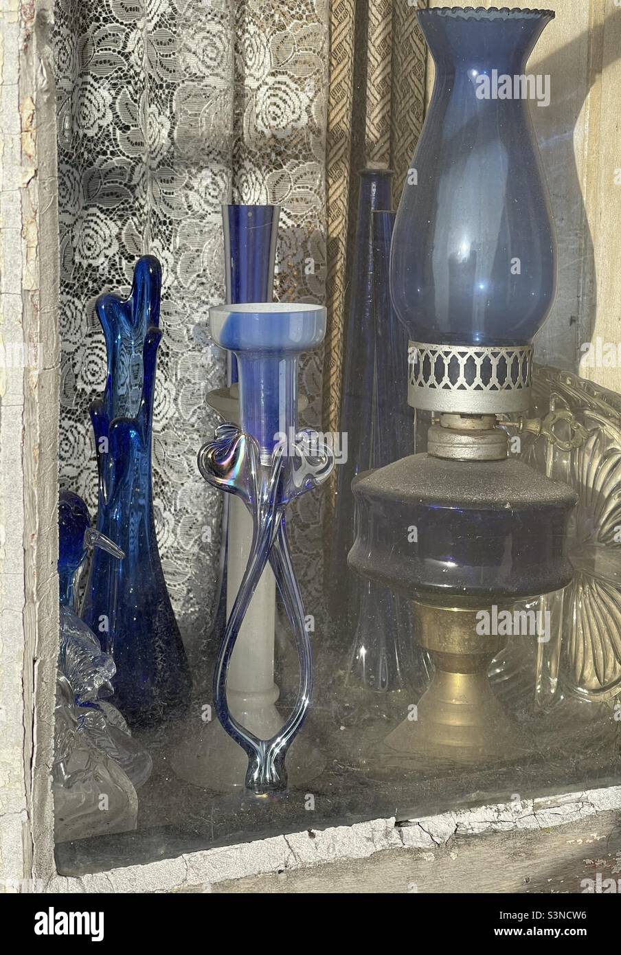 Blue glassware in window of derelict former pub (Rosemount Arms ...