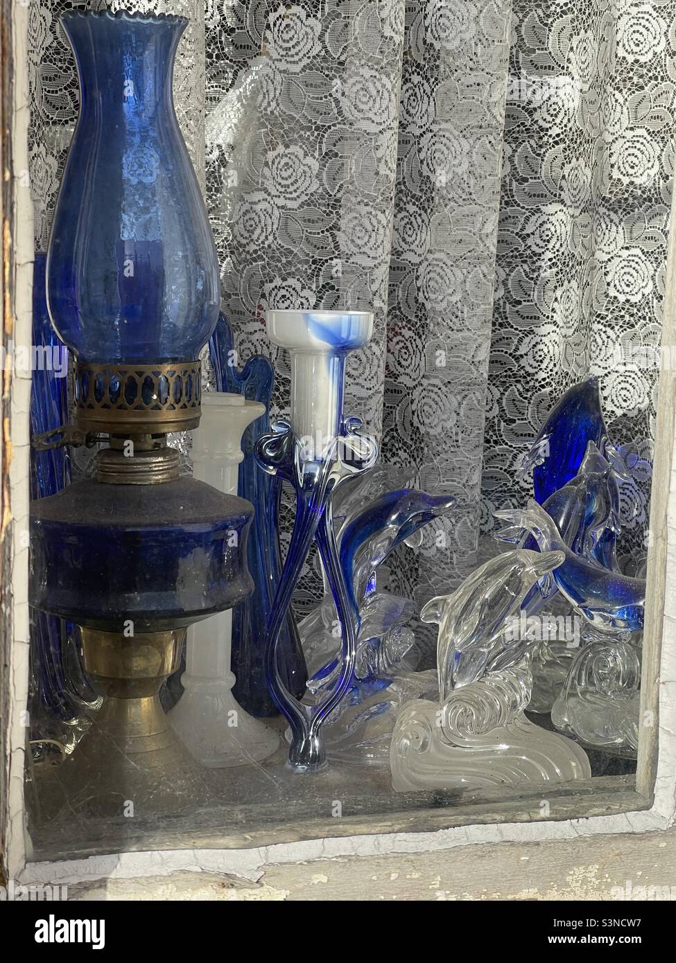 Blue glassware in window of derelict former pub (Rosemount Arms ...