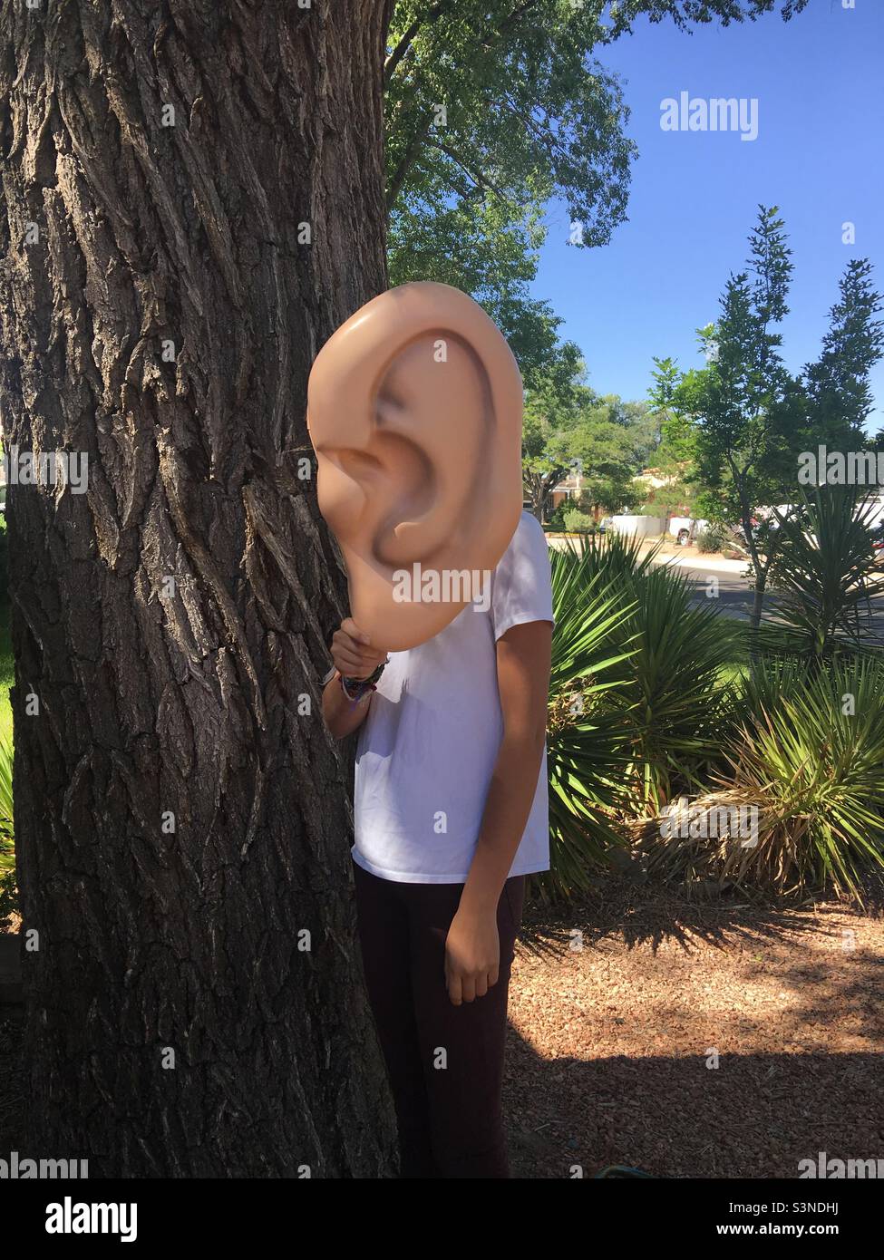 Holding ear up hi-res stock photography and images - Alamy