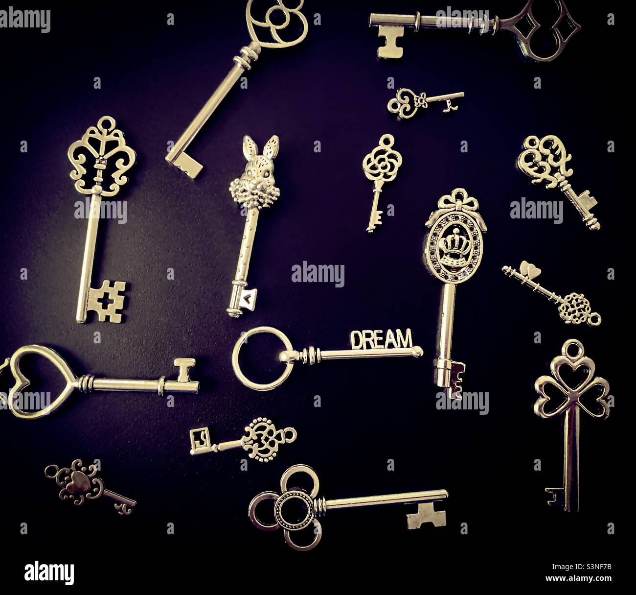 Skeleton keys, jewelry making / craft charms on a black background ...