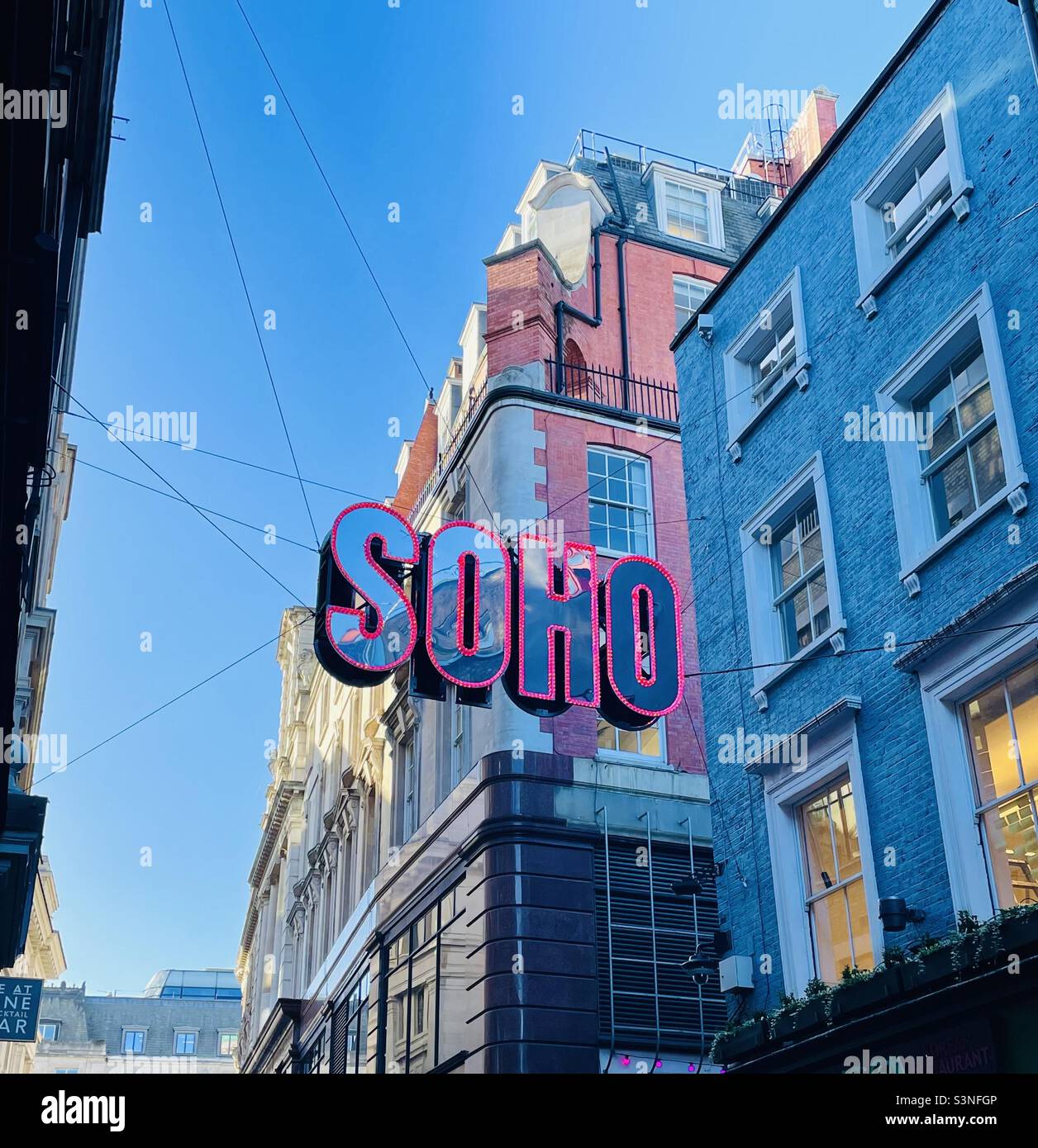 Hanging Soho Silver and Pink sign in a London street Stock Photo - Alamy