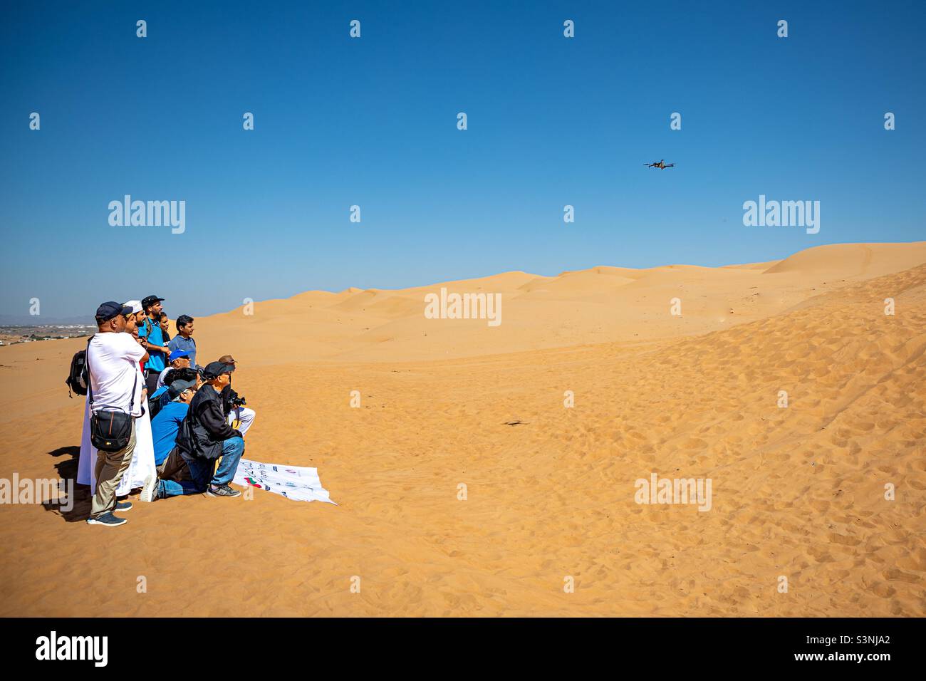 Shooting group or banner? A group photo using a drone Stock Photo - Alamy