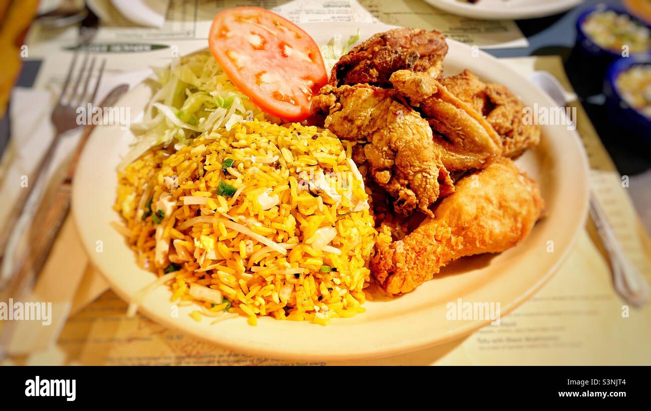 Platter combo at Flor de mayo restaurant. 1/2 Fried chicken, fried rice ...