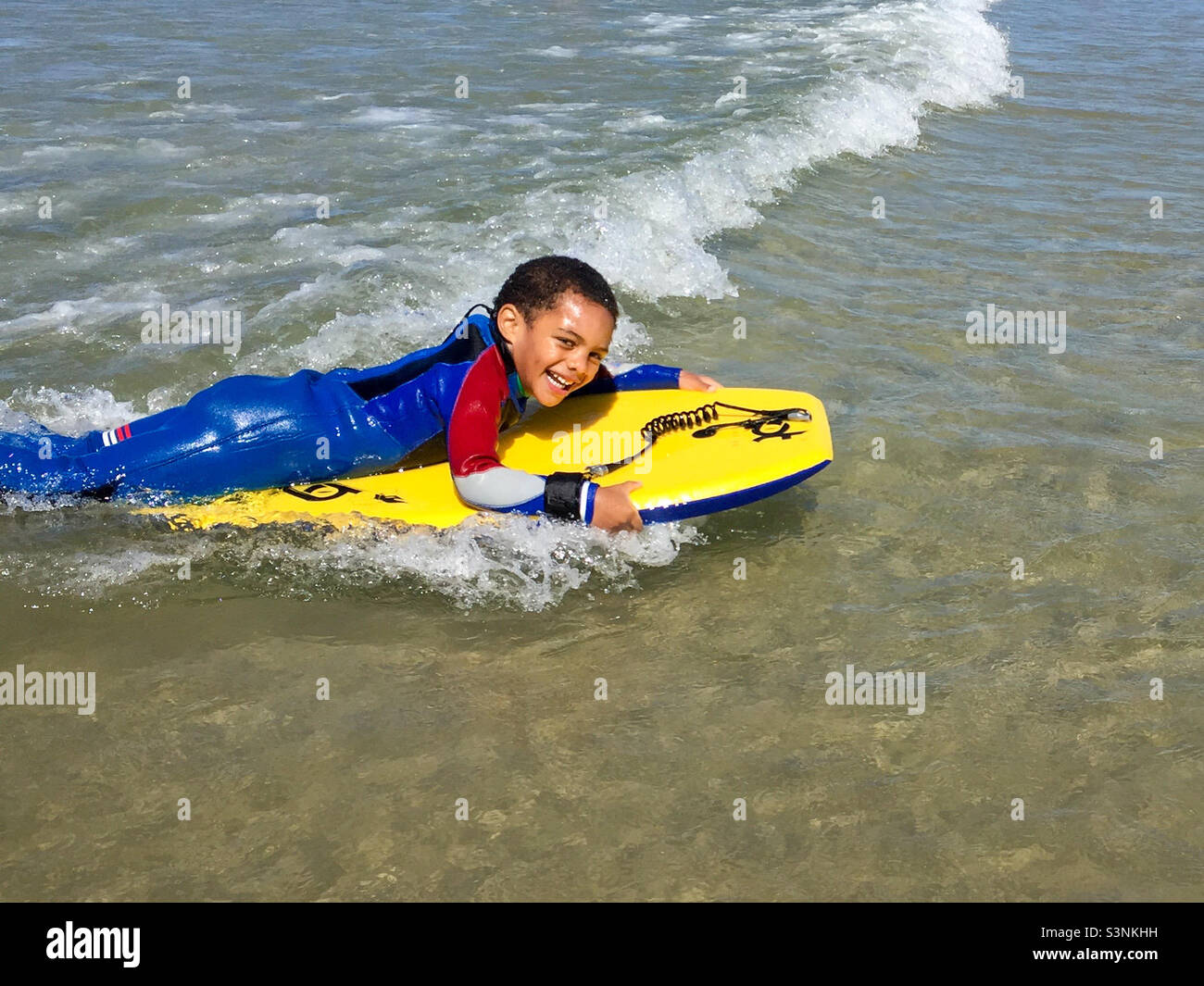 Child surf hi-res stock photography and images - Alamy