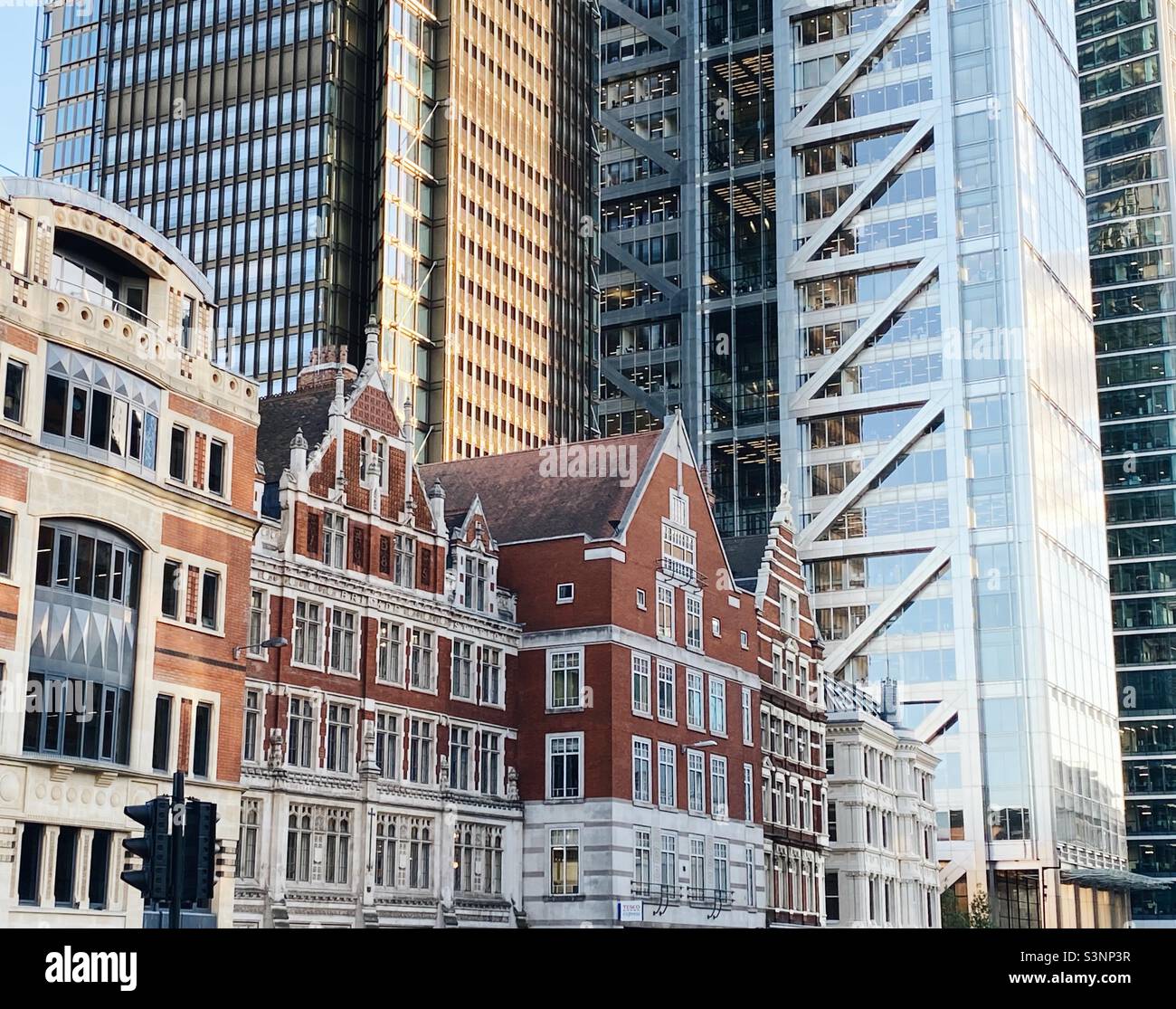Red brick houses and glass buildings on London’s Liverpool Street, East ...