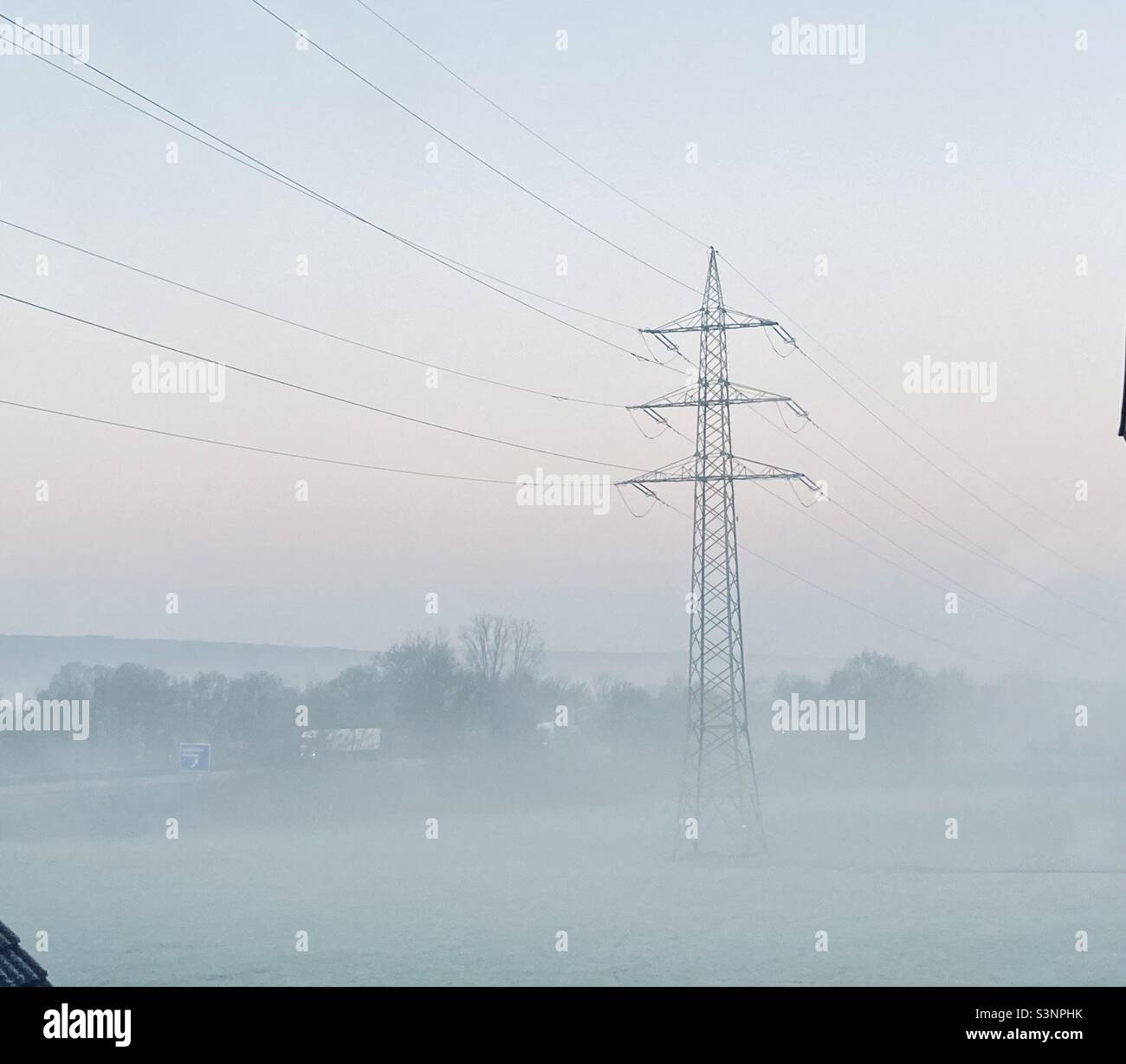 Electricity pole in the mist Stock Photo - Alamy