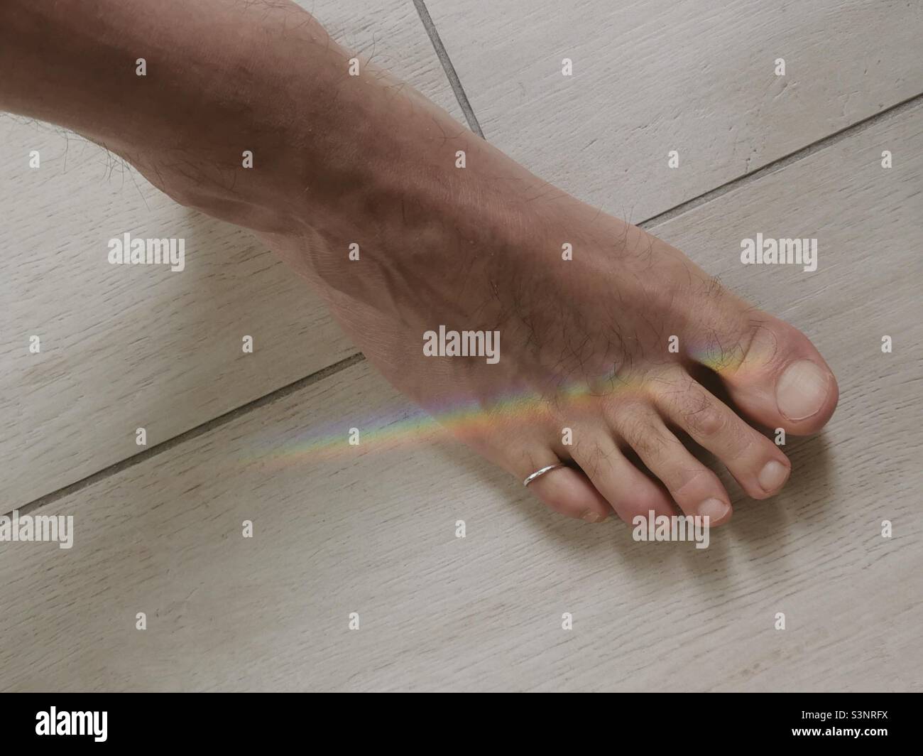 male foot with a rainbow Stock Photo - Alamy