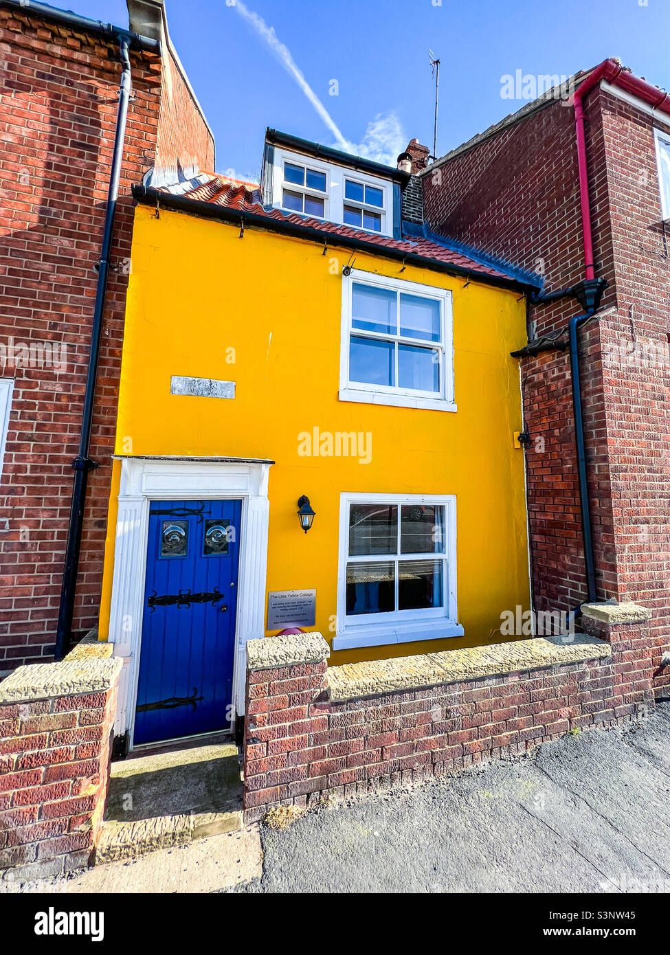 The little yellow cottage in church street in Whitby North Yorkshire ...