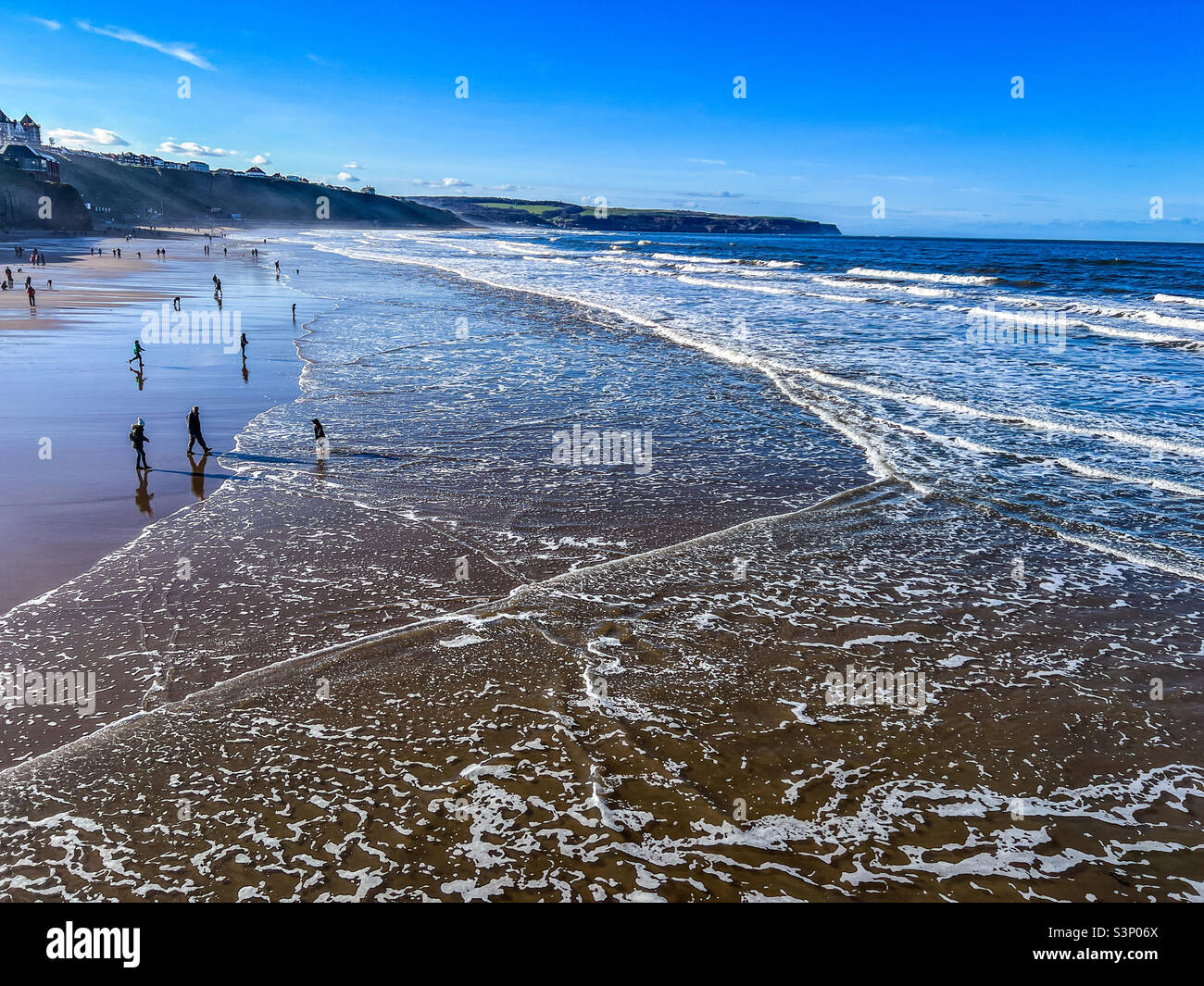Whitby beach with tide in Stock Photo - Alamy