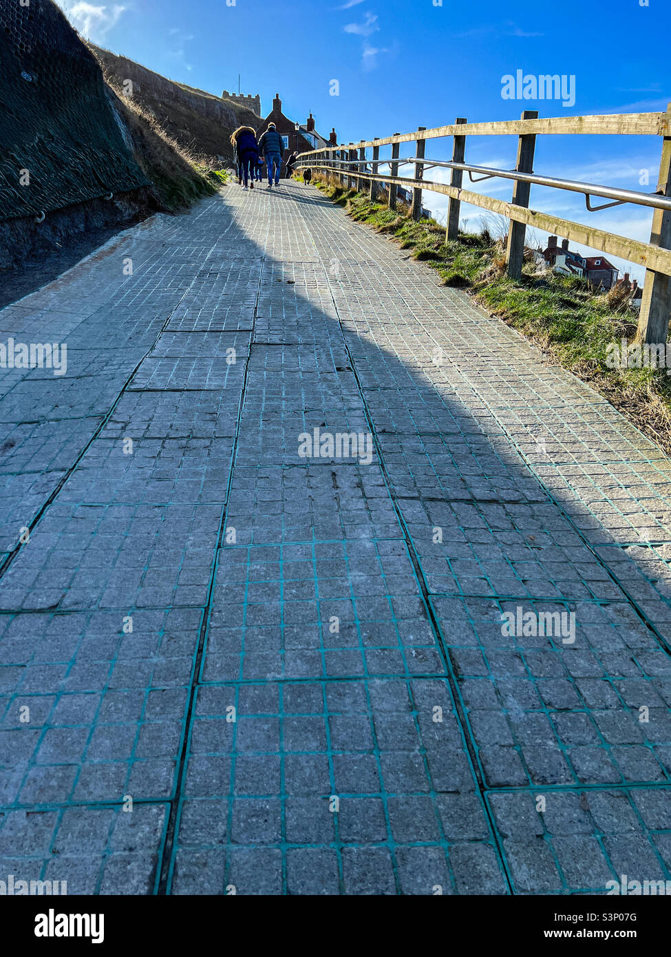 Walking up the Steep coastal path at Whitby pier Stock Photo - Alamy