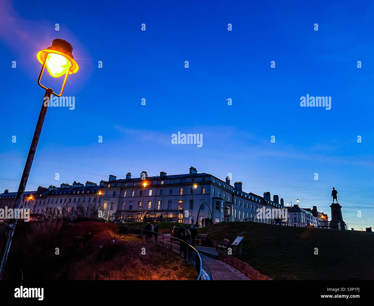 Whitby landmarks of Royal Hotel, whalebone arch and captain cook statue ...