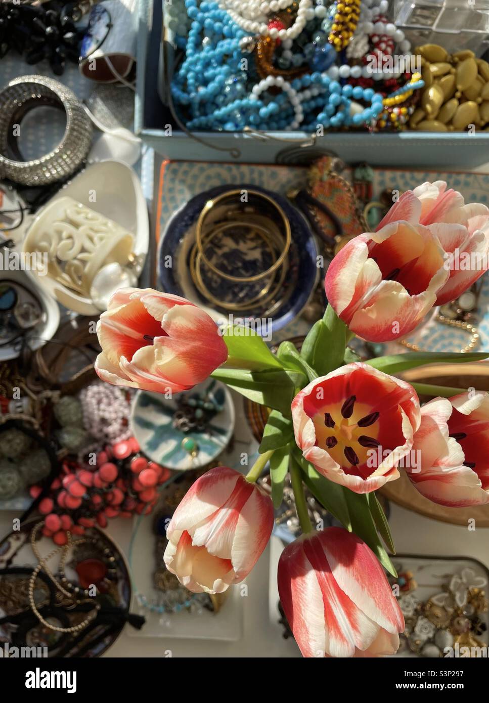Jewelry Table with fresh flowers Stock Photo - Alamy