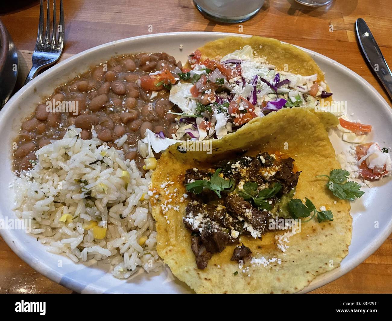 Plate of tacos with rice and beans Stock Photo - Alamy
